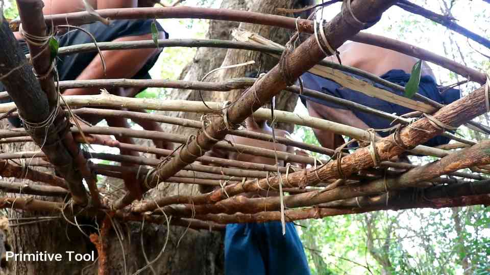Watch these primitives struggle for days to build a tree house in the ...
