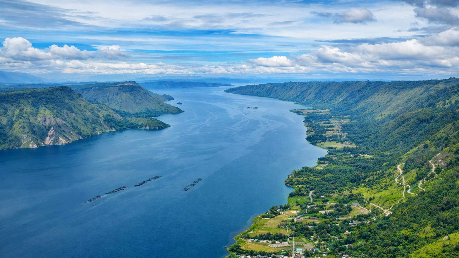 The vast waters of Lake Toba surrounded by mountains