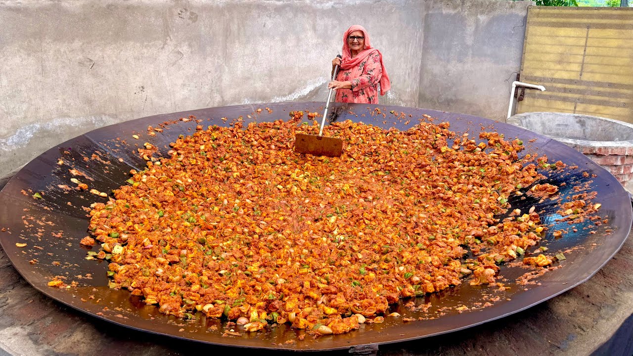 Traditional village-style kadai paneer in a large kadai