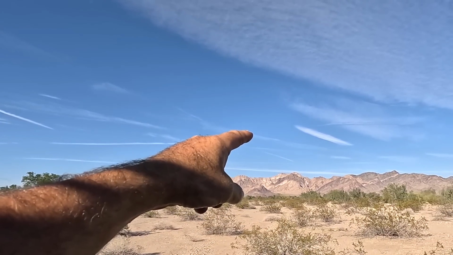 People laugh at 'chemtrails' – then he points at the sky over the Mojave