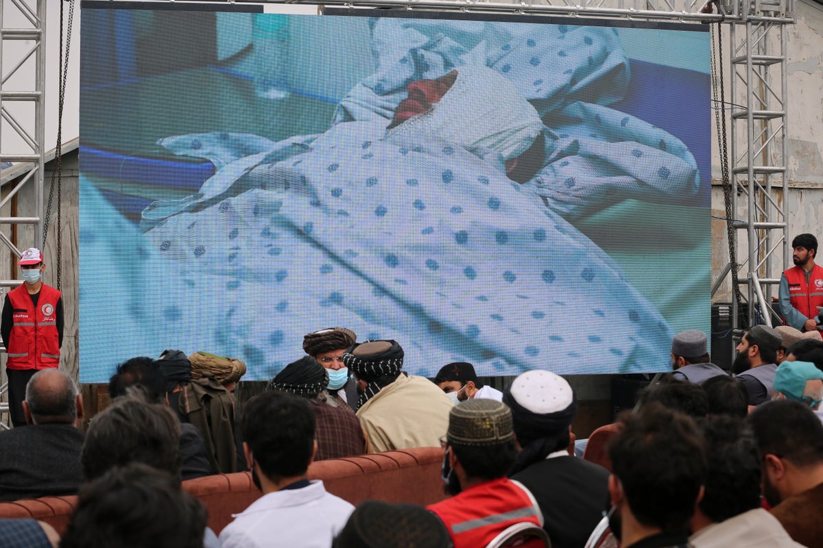 Afghans hold second mass funeral for victims of an airstrike that hit a ...