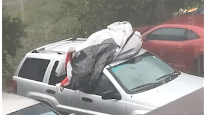 Florida man puts own body on the line to protect car from hail