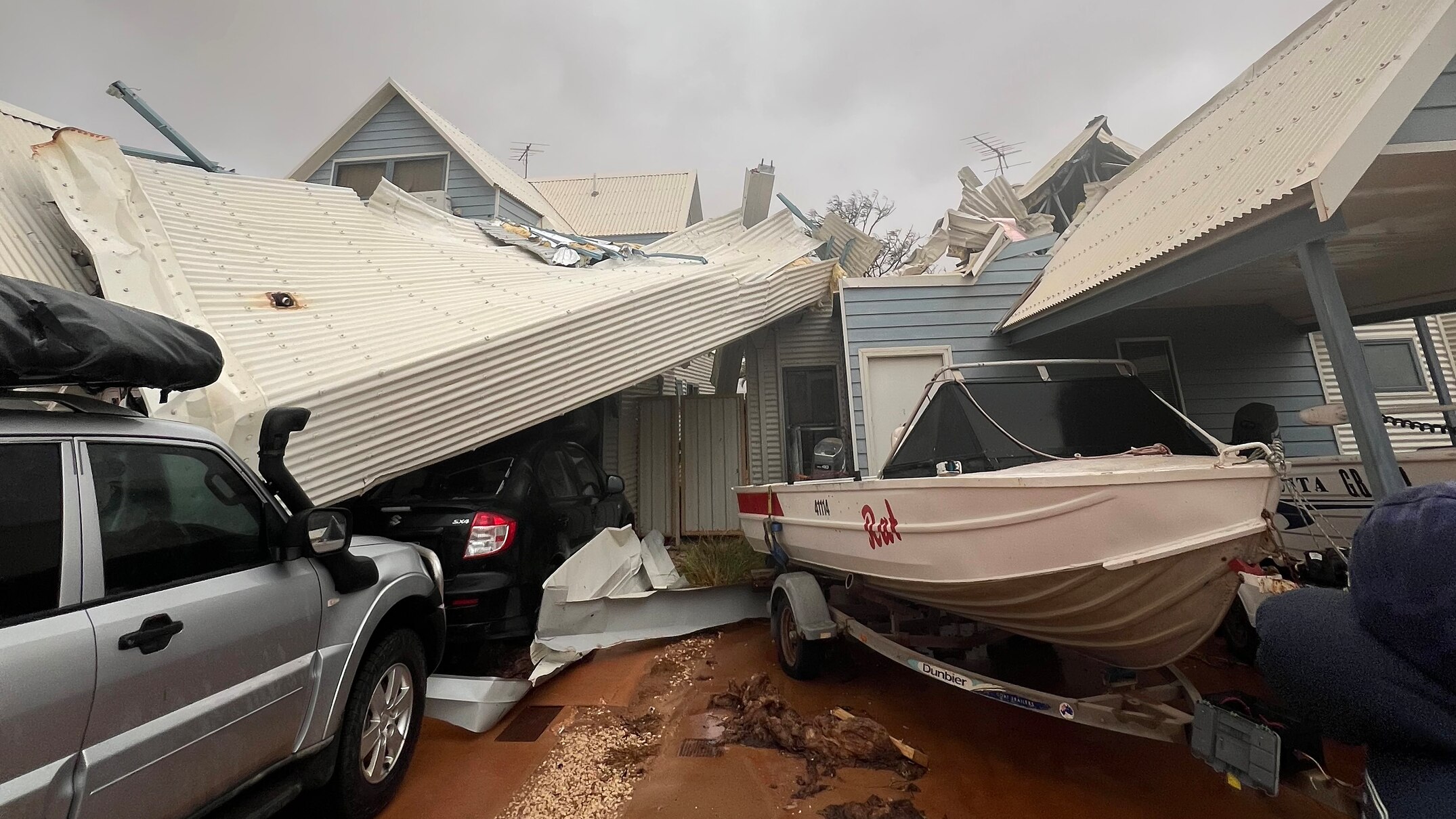 Tropical cyclone Narelle heads inland amid reports of widespread damage ...
