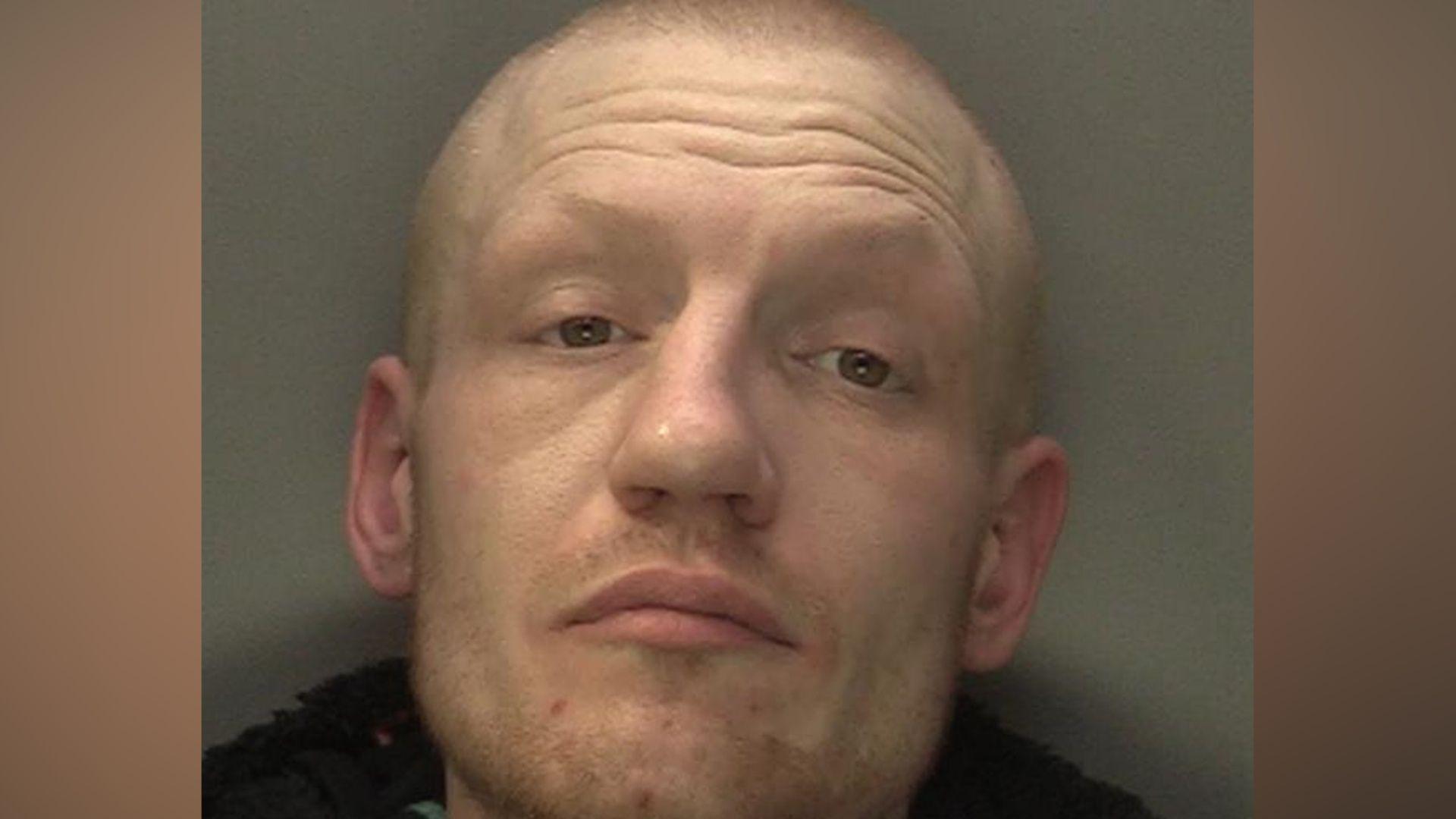 Robber jailed for stabbing shop worker in stomach