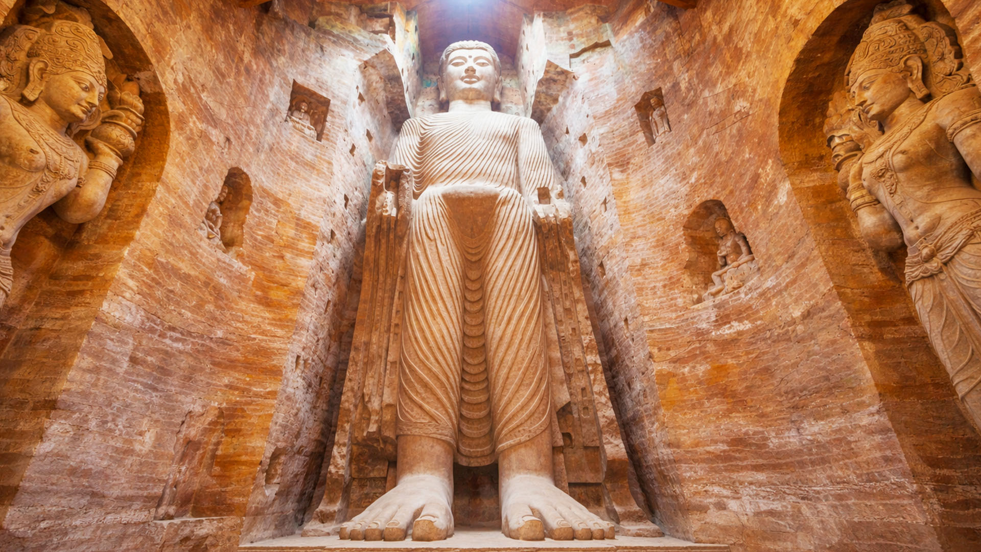 China holds a giant standing Buddha inside a stone chamber