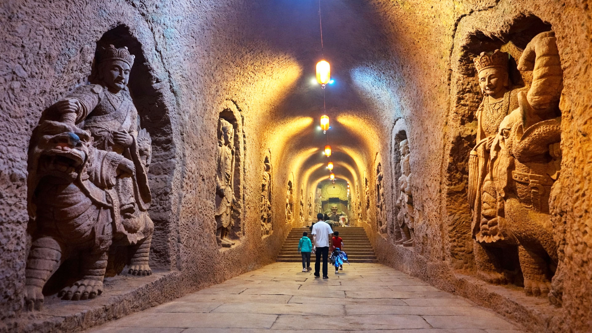 A hidden stone passage in China holds towering carved figures
