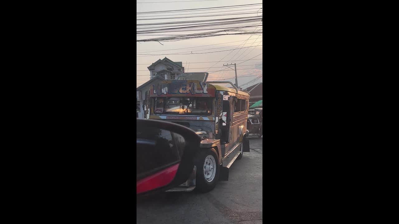 Jeepney driver counts fuel money while queueing at petrol station in ...
