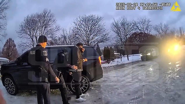 Bodycam footage shows ex-Michigan coach in tears during arrest
