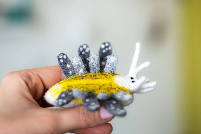 34 odd felted figurines based on real sea slugs