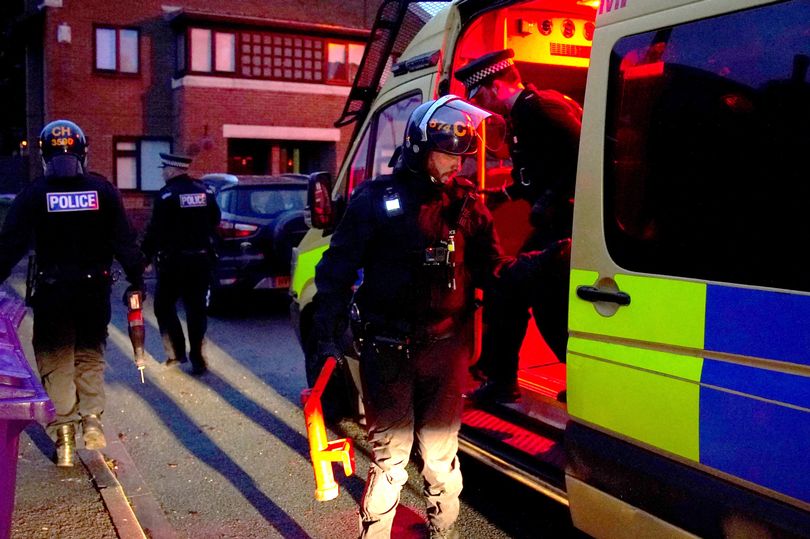 Three arrested after houses raided by police