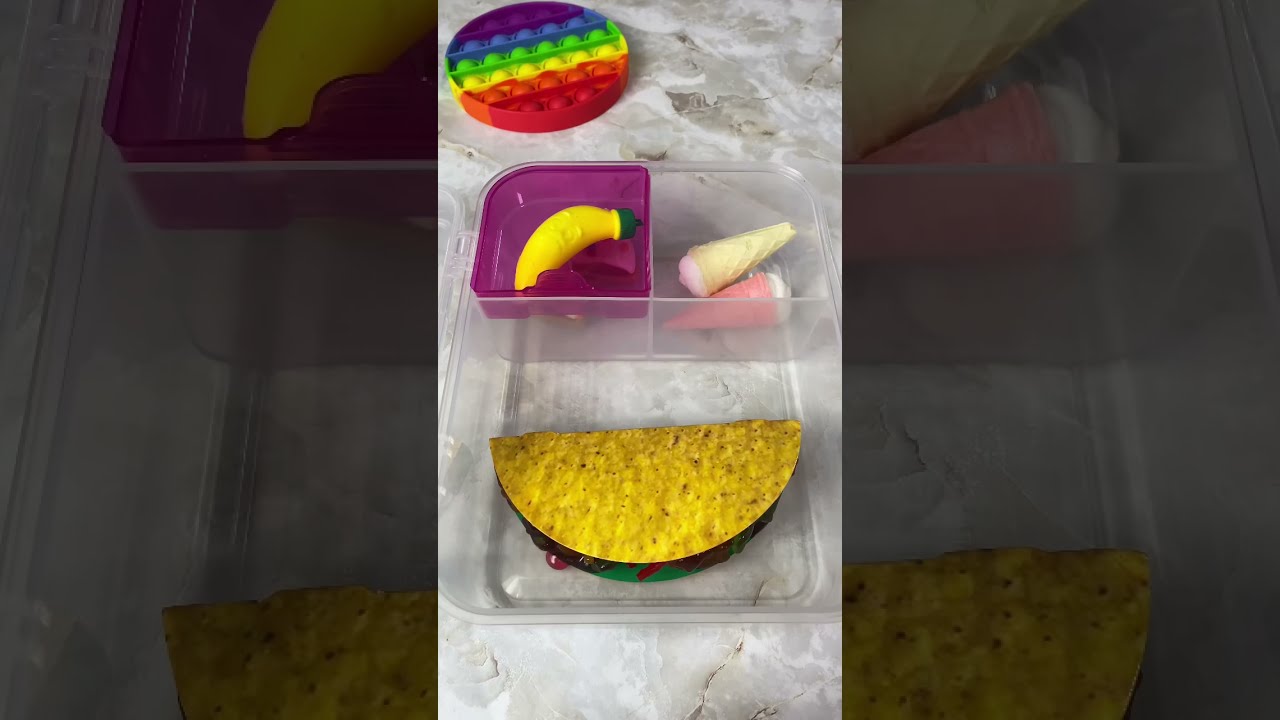 Packing school lunch with colorful donuts