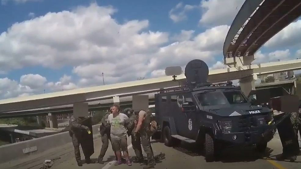 WATCH: Body camera video shows man throwing objects at police, off of ... WATCH: Body camera video shows man throwing objects at police, off of ...