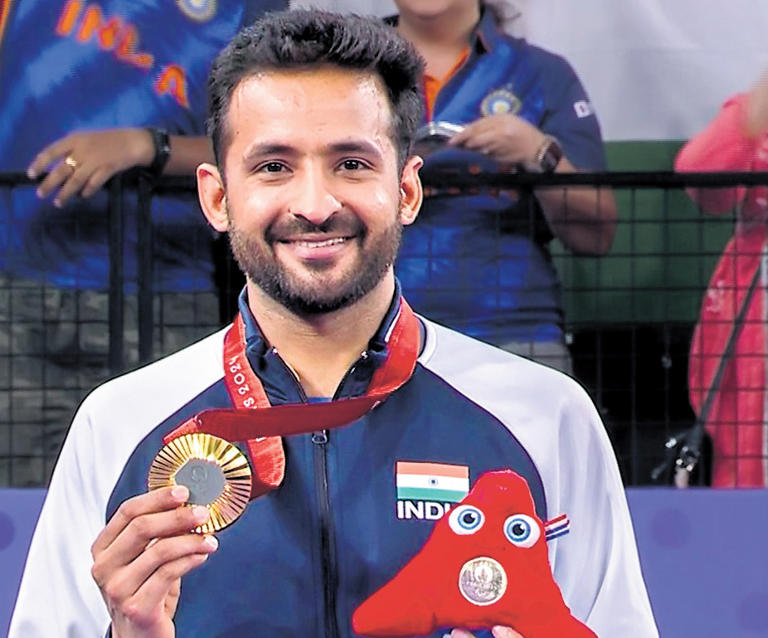 Nitesh Kumar clinches gold at Paralympics amidst Pramod Bhagat's absence Nitesh Kumar clinches gold at Paralympics amidst Pramod Bhagat's absence