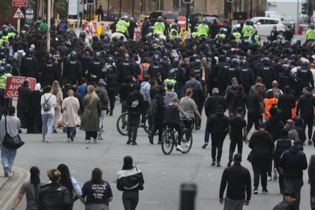 Man who nearly hit police officer with bottle in Bolton riot sentenced