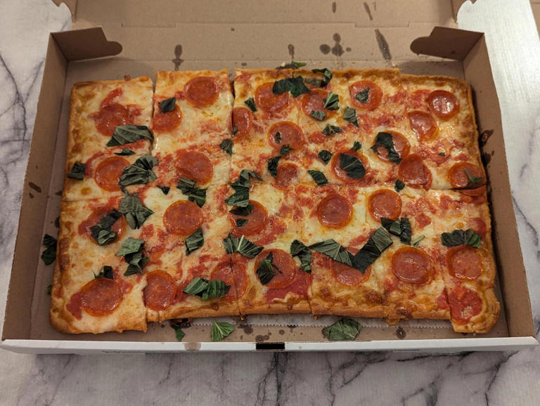 The Best Way To Cook Frozen Pizza Isn't What You Think It Is