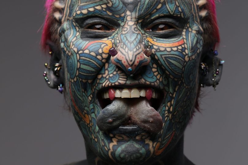 Veteran becomes most tattooed woman ever covering 99.98% of body ...
