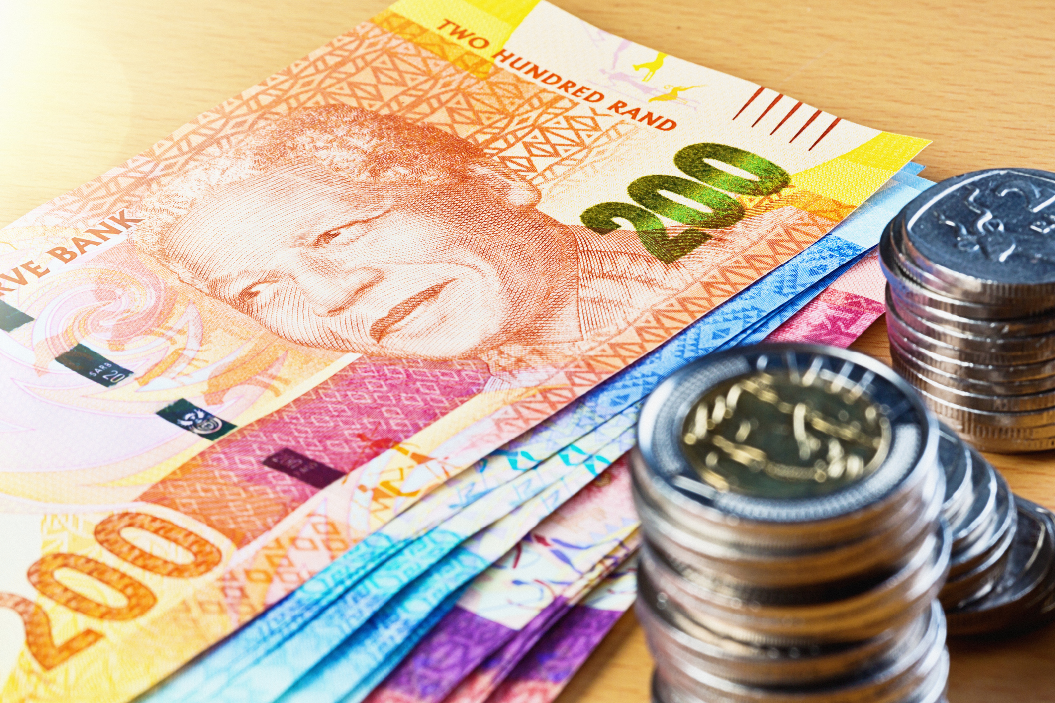 Rand swings sharply as global tensions ease