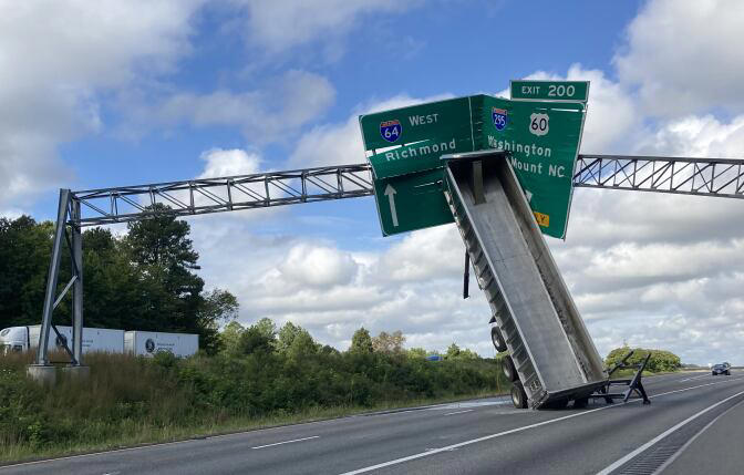 Tractor-trailer driver charged after crash shuts down part of I-64 Tractor-trailer driver charged after crash shuts down part of I-64