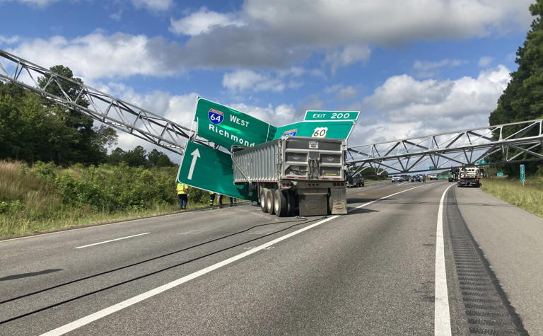 Tractor-trailer driver charged after crash shuts down part of I-64 Tractor-trailer driver charged after crash shuts down part of I-64