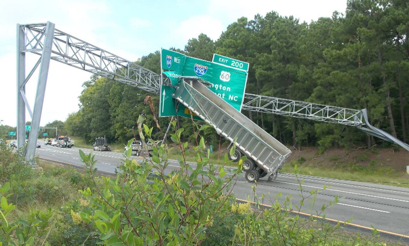 Tractor-trailer driver charged after crash shuts down part of I-64 Tractor-trailer driver charged after crash shuts down part of I-64