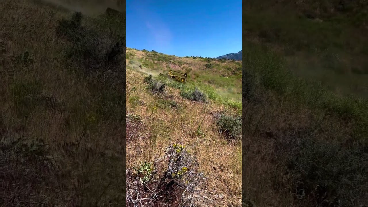 Watch This Old Dozer Take a Tumble Downhill