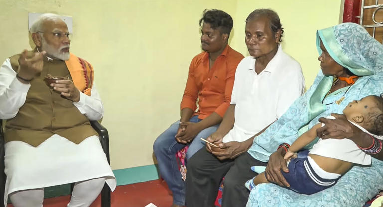 PM Modi interacts with PMAY beneficiaries in Bhubaneswar slum PM Modi interacts with PMAY beneficiaries in Bhubaneswar slum
