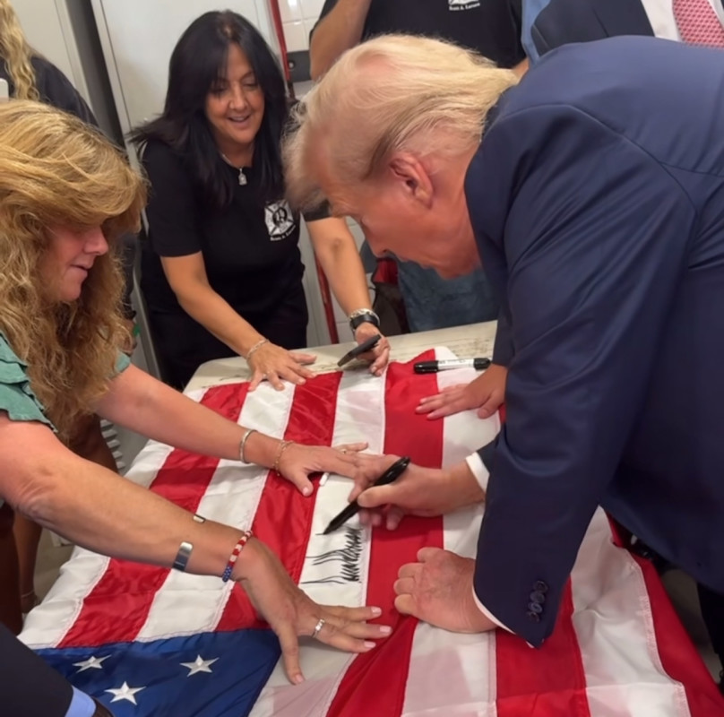Viral Video: Trump Violated Flag Code, Signed American Flag on 9/11