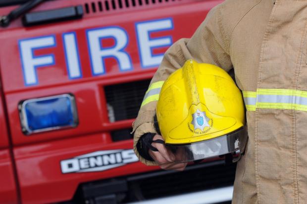 Police close road as crews tackle chimney fire at Runcorn house ...