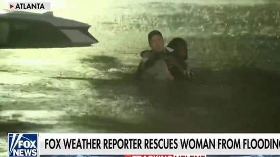 Fox weather reporter abandons broadcast to rescue woman trapped in ... Fox weather reporter abandons broadcast to rescue woman trapped in ...