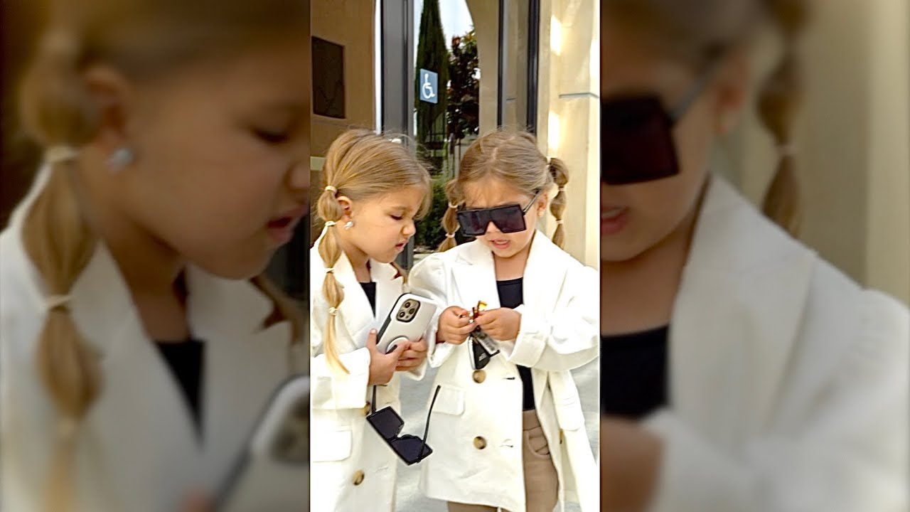 Four-year-old twins pretend to earn their official driver's license