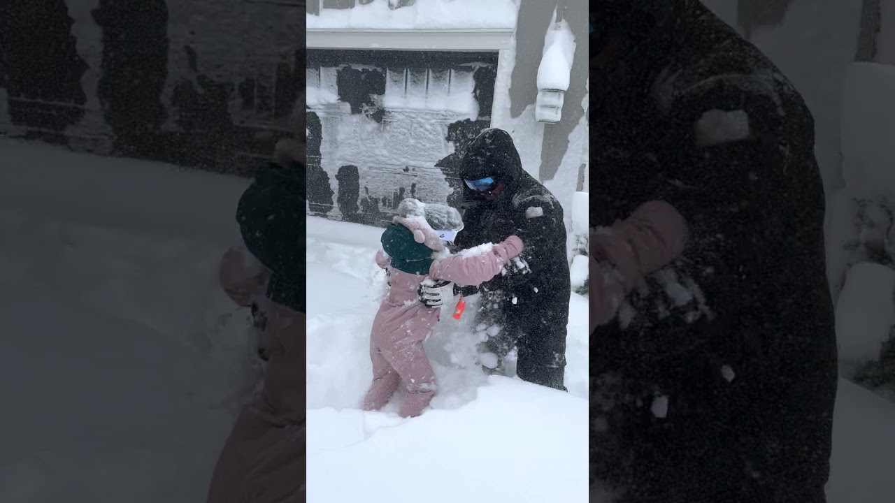 Watch the hilarious moment a young girl gets lost in a massive snow pile
