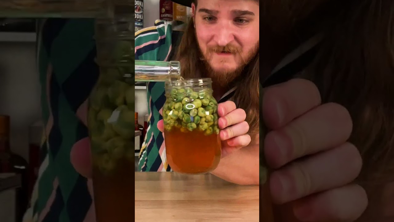Infusing wasabi peas in matcha vodka for one week