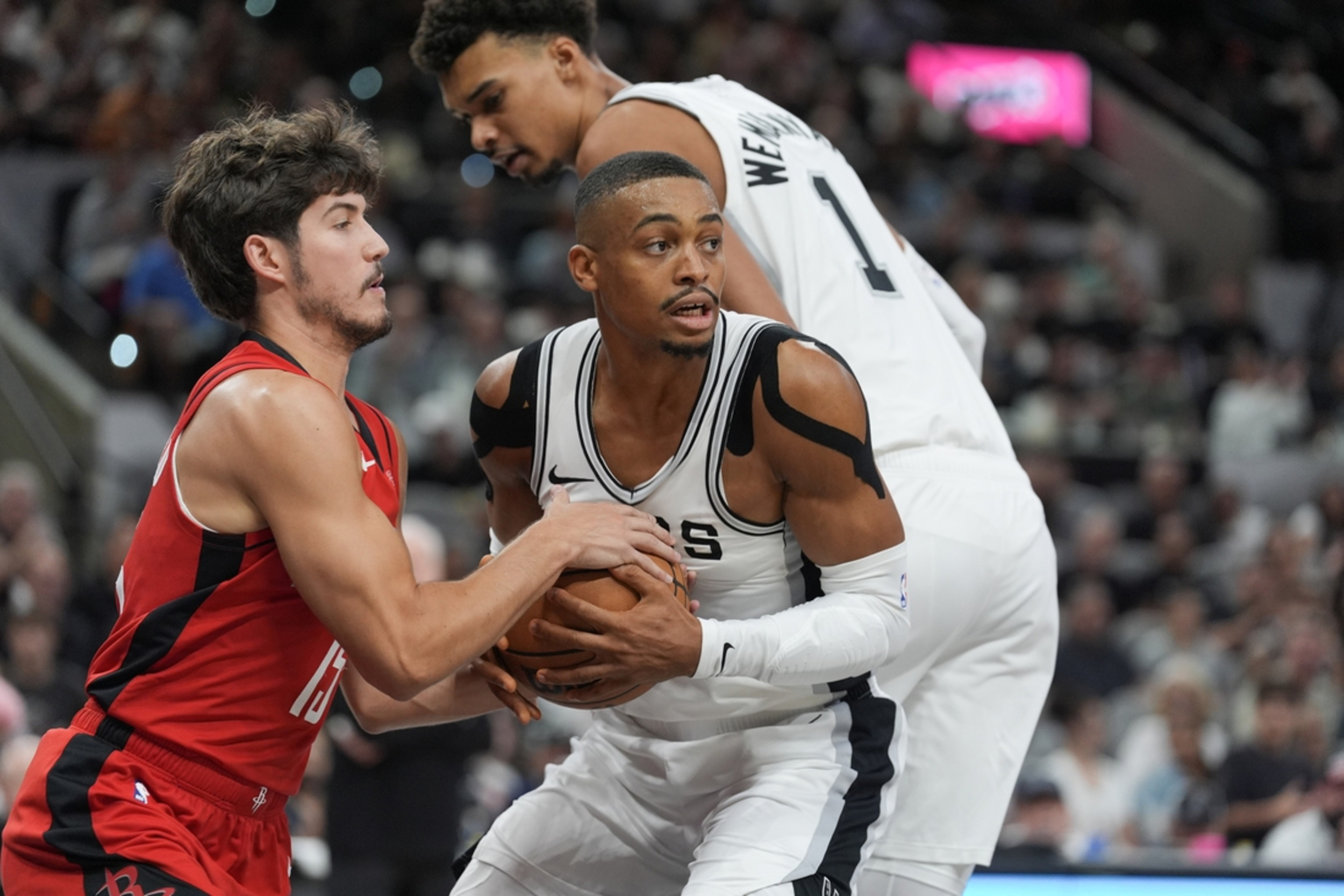 Spurs hold off late Rockets rally to get first win Spurs hold off late Rockets rally to get first win
