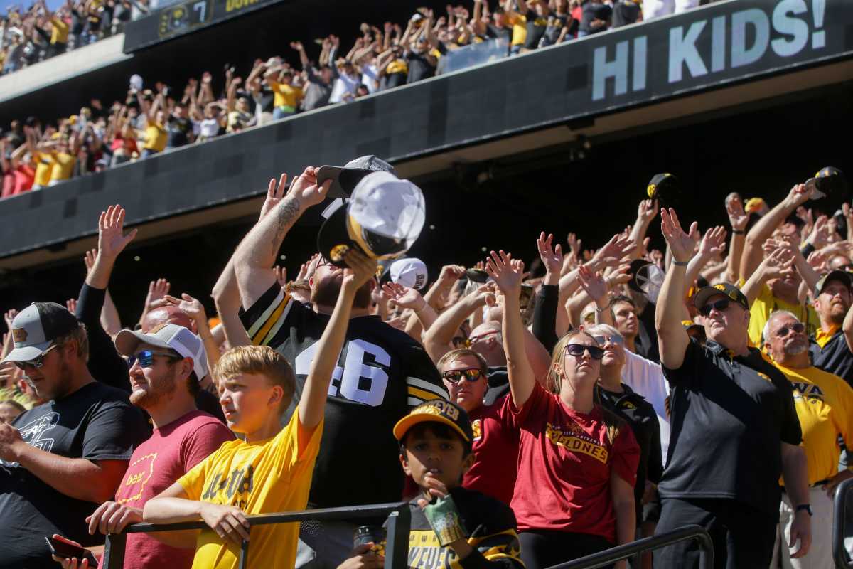 WATCH: UW Football Players Partake in Iowa Wave Tradition