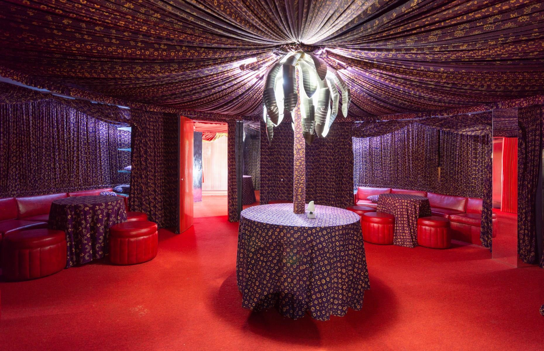 Inside the abandoned mansion with a sinister red room