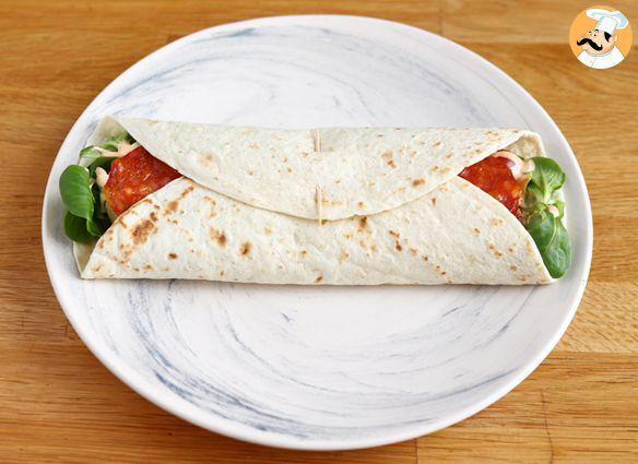 Chorizo, avocado, and tomato wrap sandwich