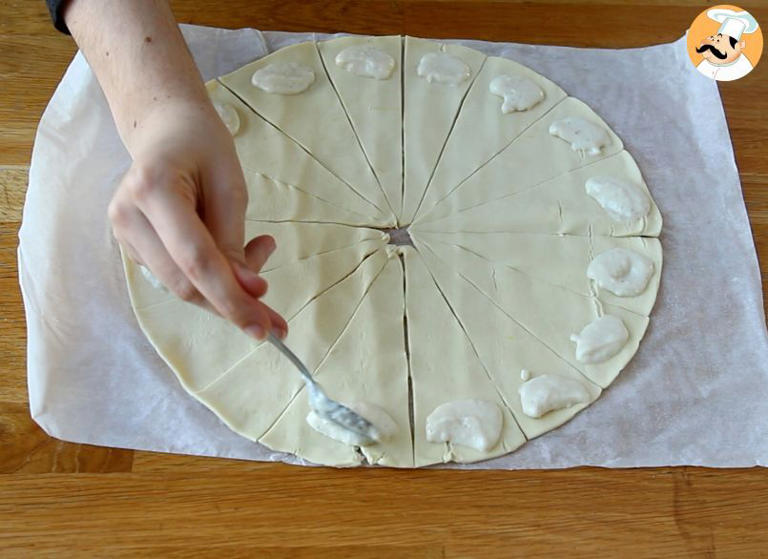 Puff pastry croissants with bechamel, ham, and cheese