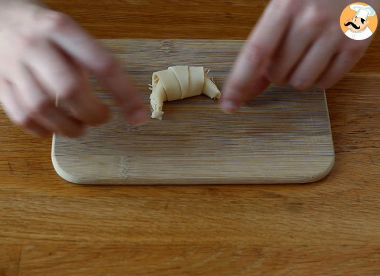 Puff pastry croissants with bechamel, ham, and cheese