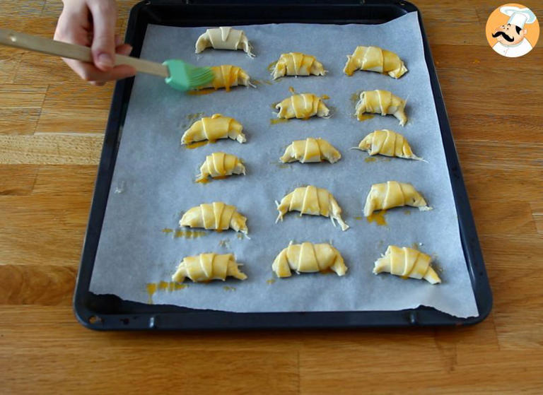 Puff pastry croissants with bechamel, ham, and cheese