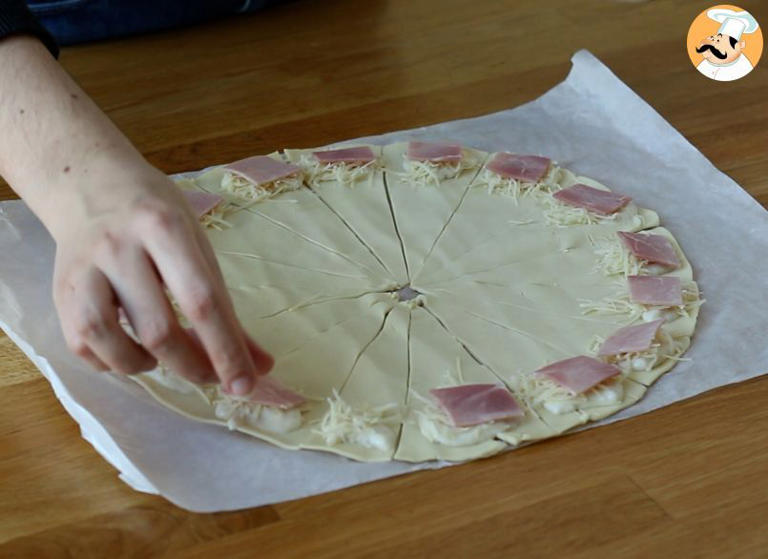 Puff pastry croissants with bechamel, ham, and cheese