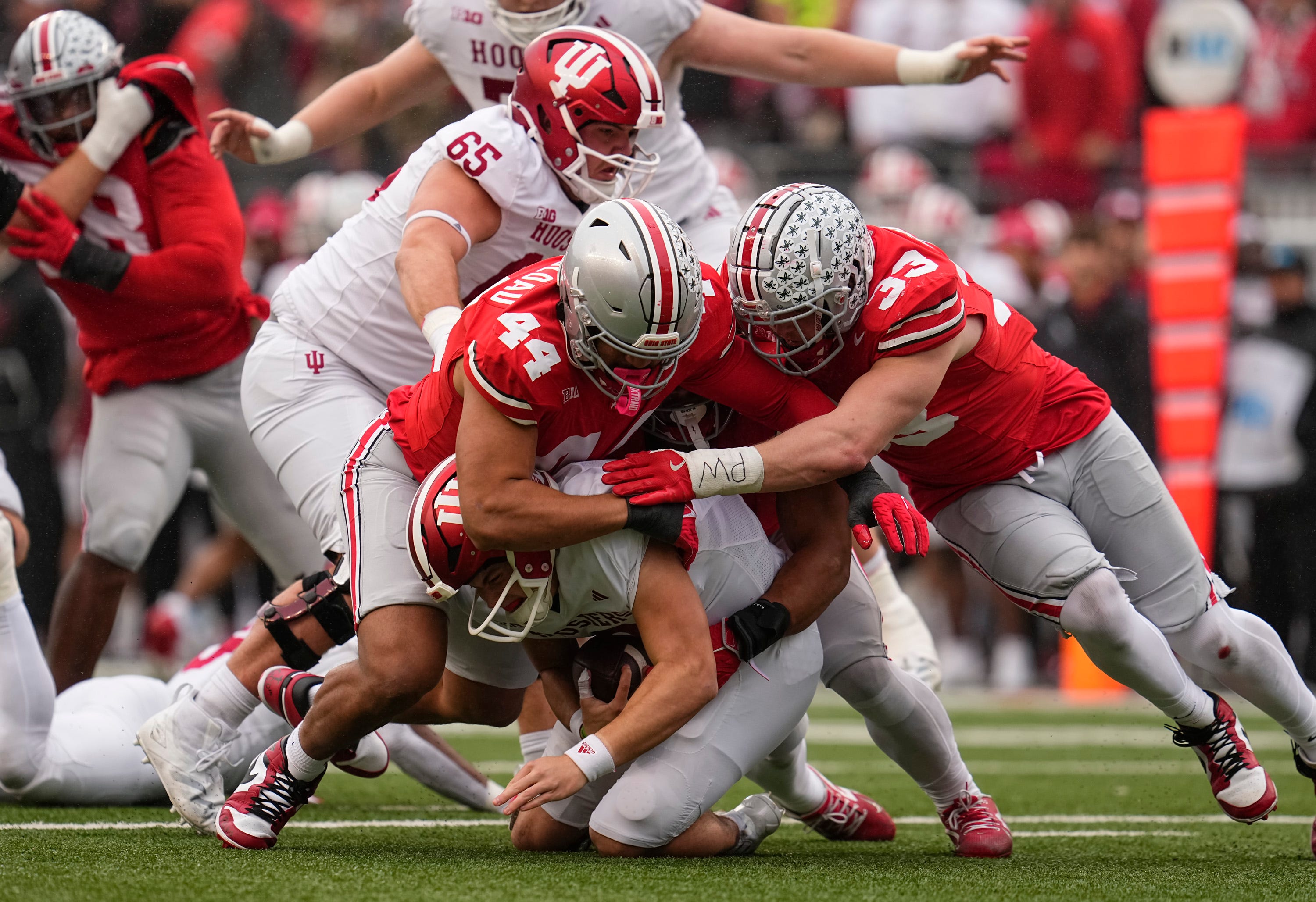 Ohio State defensive ends J.T. Tuimoloau, Jack Sawyer proving opposites ...