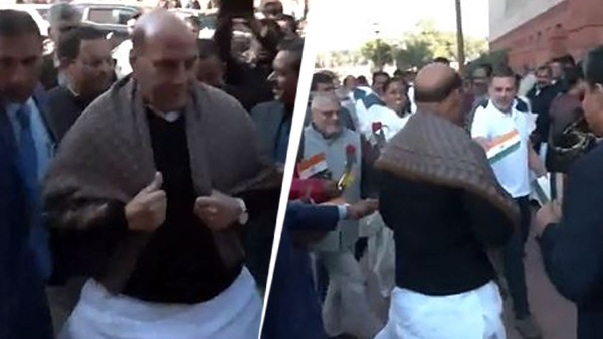 Rahul Gandhi gives rose, Tricolour to Rajnath Singh during Parliament ... Rahul Gandhi gives rose, Tricolour to Rajnath Singh during Parliament ...