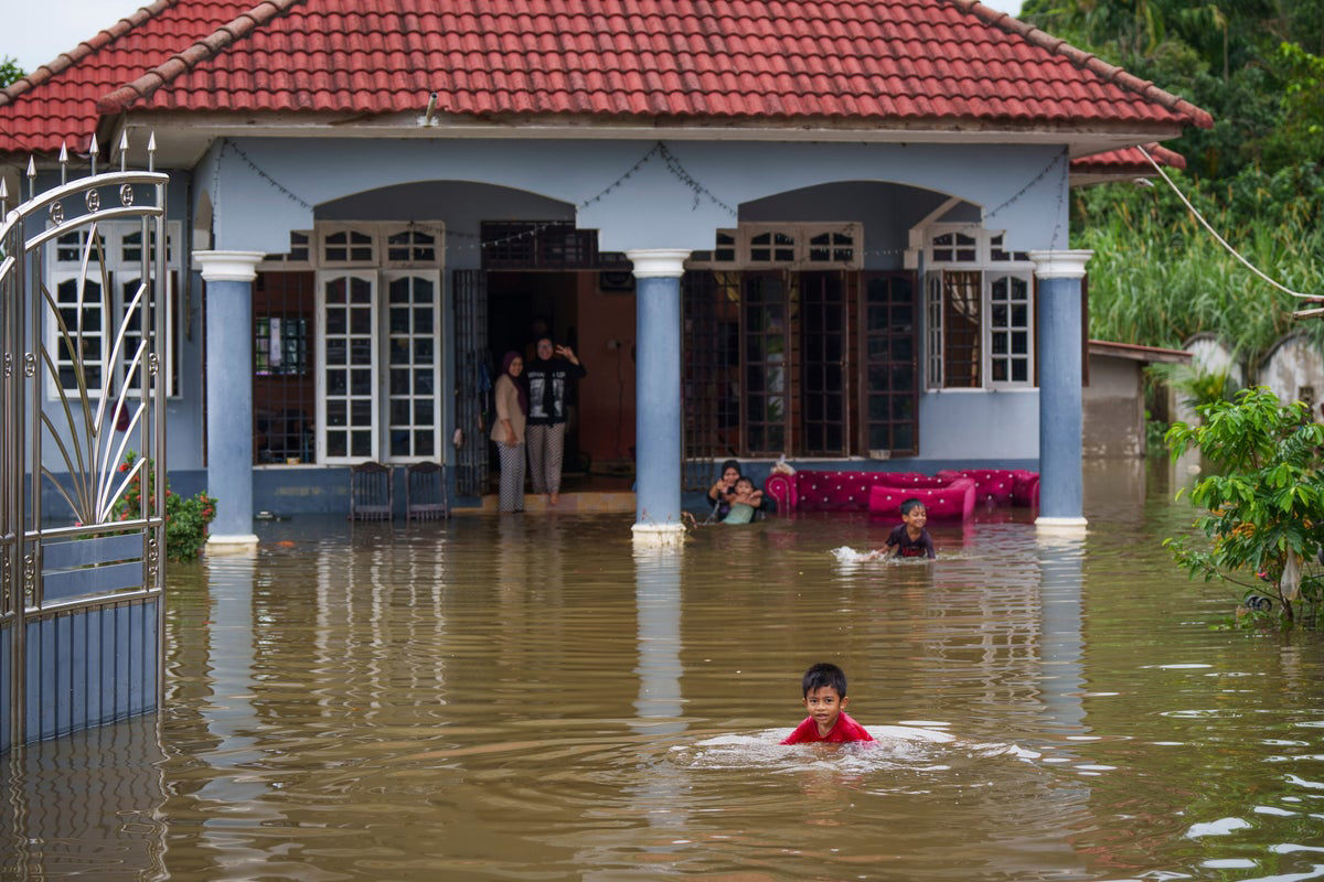 PHOTO COLLECTION: Malaysia Floods PHOTO COLLECTION: Malaysia Floods