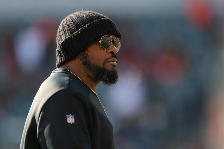 Mike Tomlin reacts to the Ravens firing head coach John Harbaugh