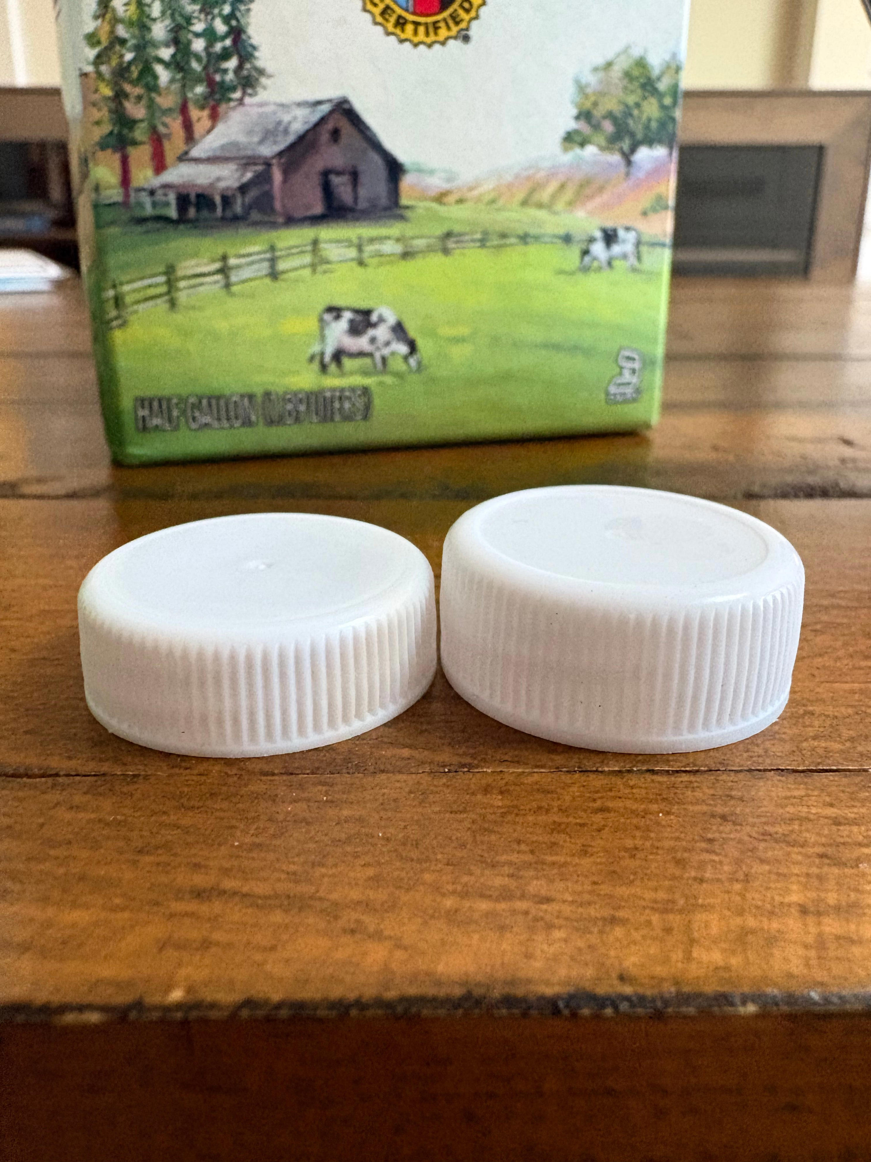 New, taller milk carton caps are easier to grasp, twist