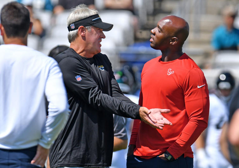 Jacksonville Jaguars' Doug Pederson holds New York Jets QB Aaron ...