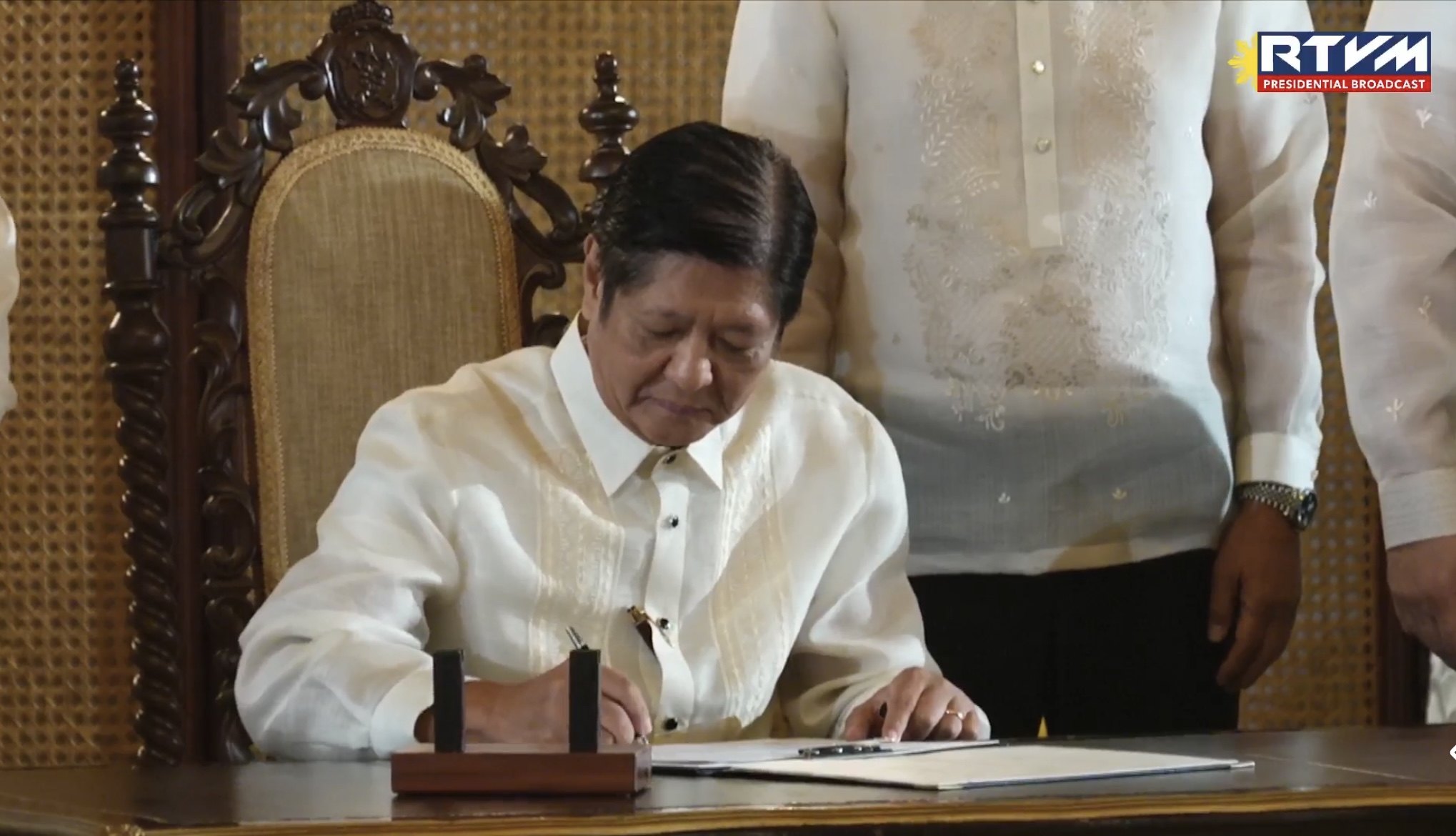 Marcos inks law fixing three-year term of PCG chief