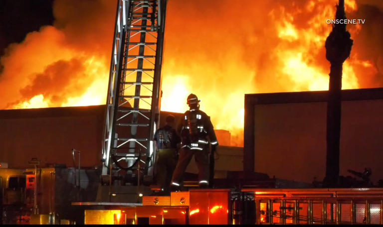 Fire Erupts Near Manufacturing Plant Damages Vehicles, Prompts Road Closure