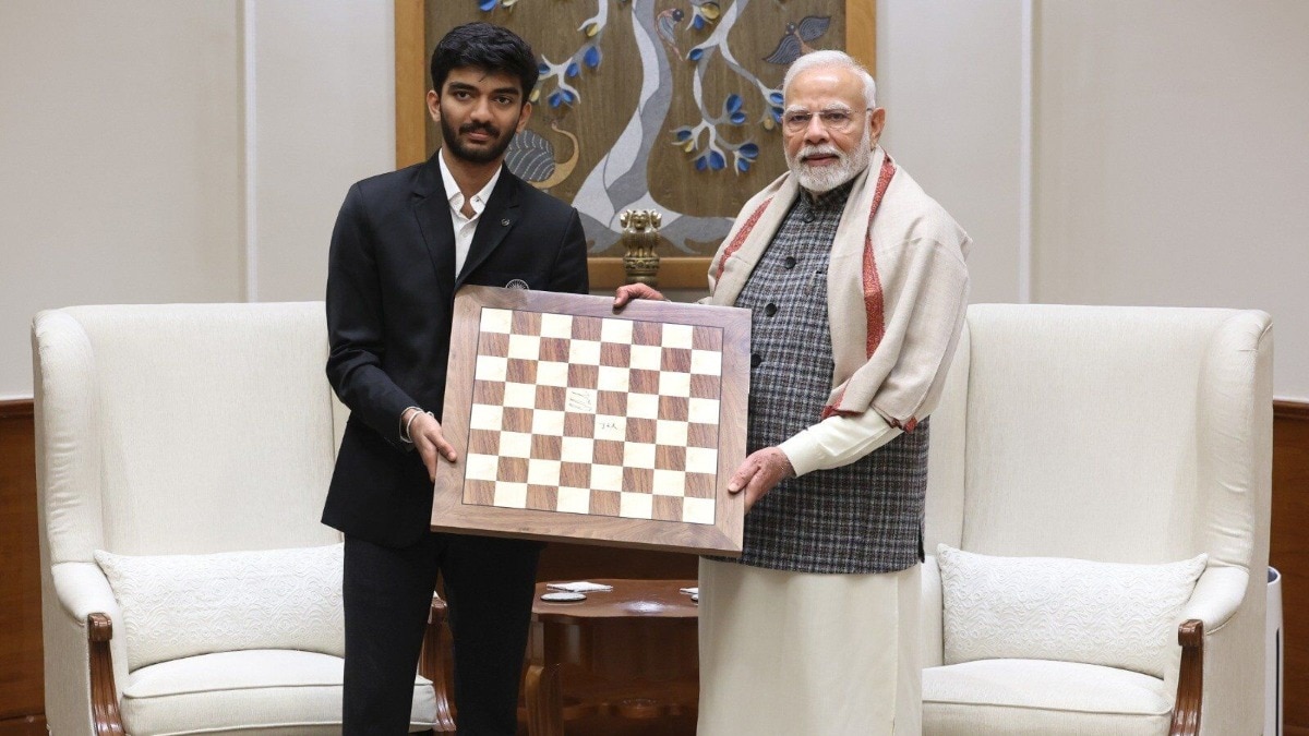 PM Narendra Modi meets D Gukesh, receives signed chess board from world ...