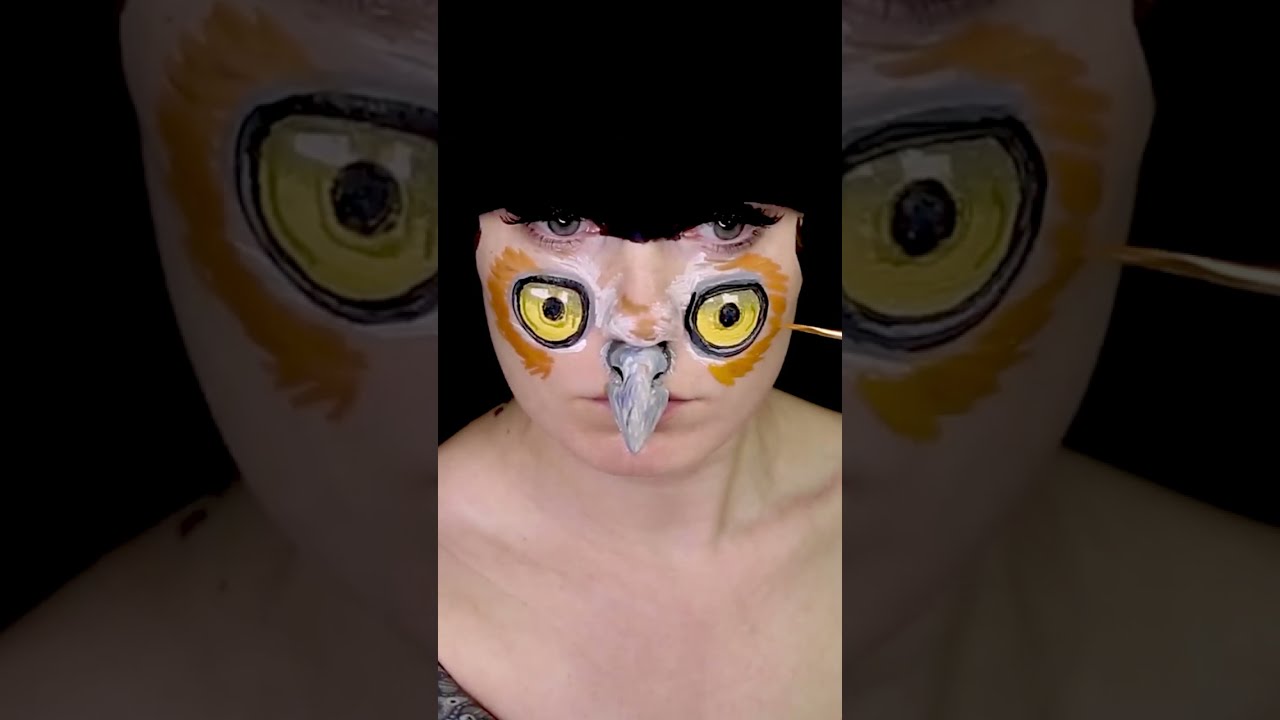 Owl-inspired makeup turns the model into a creature of night